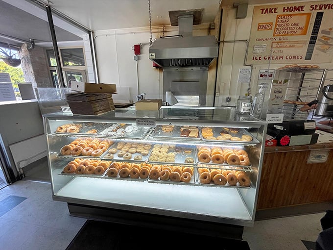 Donut display case—the adult version of pressing your nose against a toy store window.