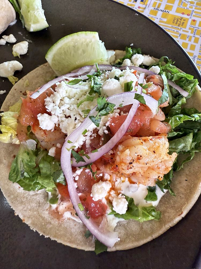 This isn't just a fish taco—it's a vacation on a tortilla. Fresh shrimp, diced tomatoes, and purple onion create a colorful flavor fiesta.