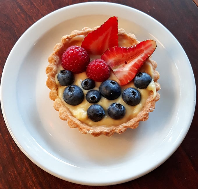A fruit tart that's both gallery-worthy art installation and perfect breakfast—those blueberries arranged with the precision of a Swiss watchmaker.