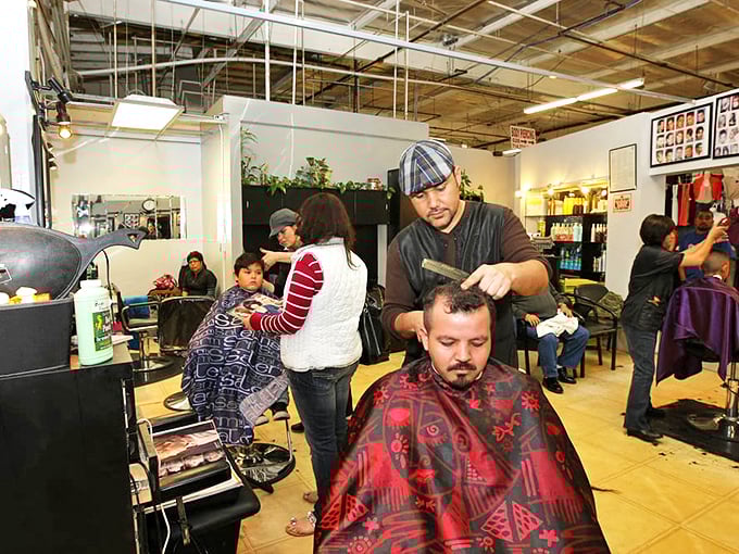 The barbershop buzzes with conversation as important as the haircuts themselves—a community gathering spot where style transformations happen in real-time.