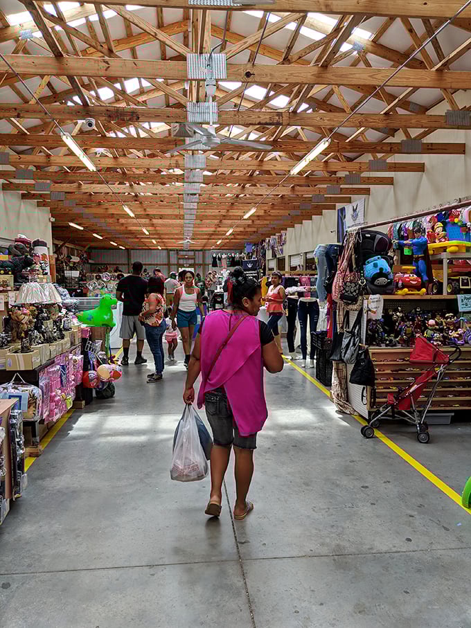 The market's wide, well-lit corridors invite exploration, with each step promising new discoveries. That shopper's bag suggests mission accomplished.