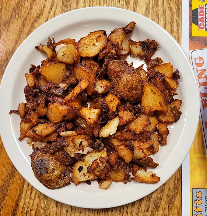 Home fries so perfectly crispy they deserve their own fan club – each bite a symphony of golden-brown potato perfection.