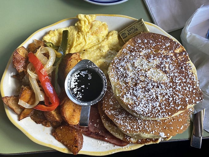 Sweet meets savory in perfect harmony. Those pancakes dusted with powdered sugar are practically begging for a maple syrup baptism.