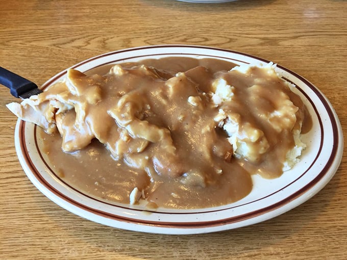 Hot turkey and gravy—the dish that whispers "there, there" to your soul like a culinary grandmother who knows you need comfort.