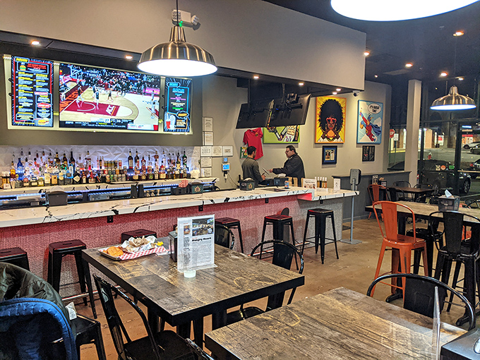 Where industrial meets inviting. The rustic wood tables and pendant lighting create the perfect backdrop for serious burger business.
