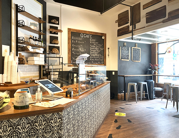 The counter where magic happens: part bakery, part social hub. That patterned tile front isn't just pretty—it's the gateway to carbohydrate heaven.