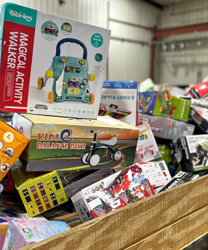 Kids' toys stacked with cheerful abandon—baby walkers and balance bikes that would make any grandparent the hero of birthday season.
