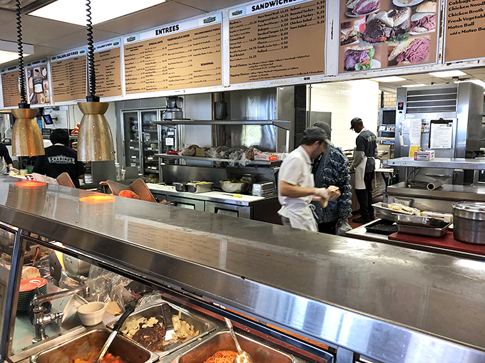 The kitchen—where sandwich magic happens daily and the art of proper meat-stacking reaches Olympic-level proportions.