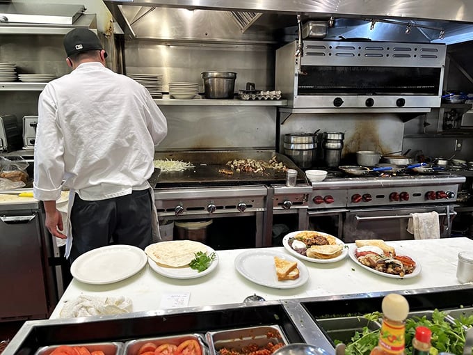 Behind every perfect breakfast is a kitchen ballet—spatulas flying, eggs cracking, and short-order cooks performing miracles on a timeline measured in minutes.