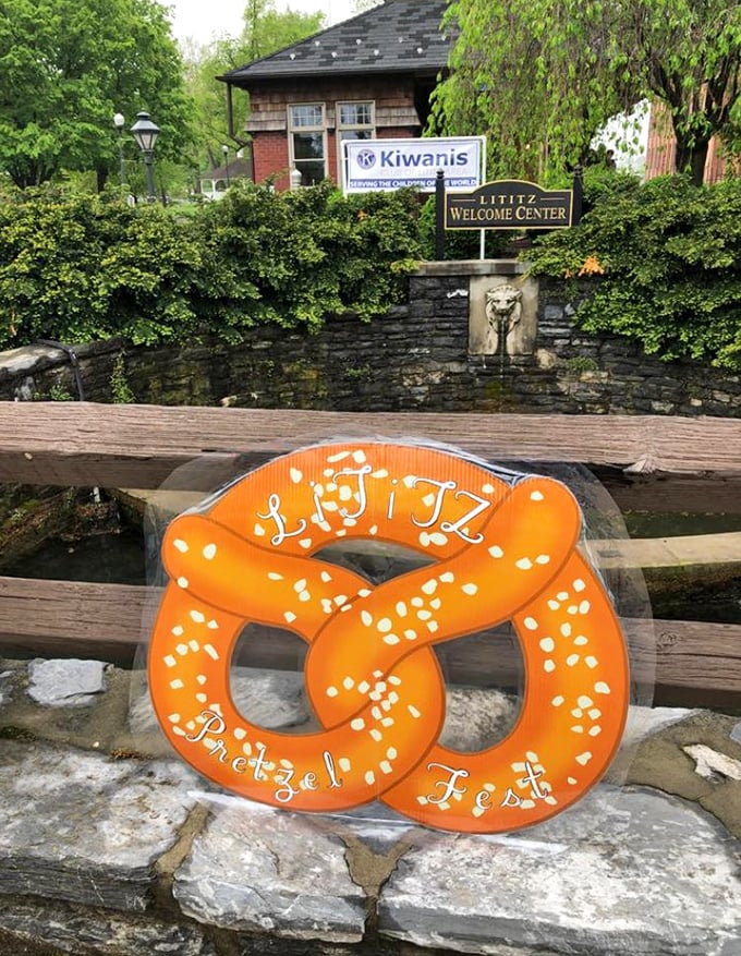 Nothing says "We take our pretzels seriously" quite like a giant orange pretzel sculpture announcing a festival dedicated to twisted dough perfection.