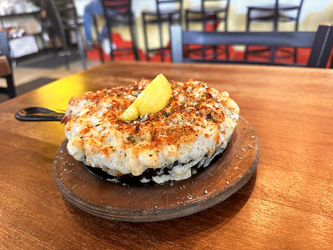 This crab dish isn't just a meal—it's a seafood celebration on a wooden pedestal where it rightfully belongs.
