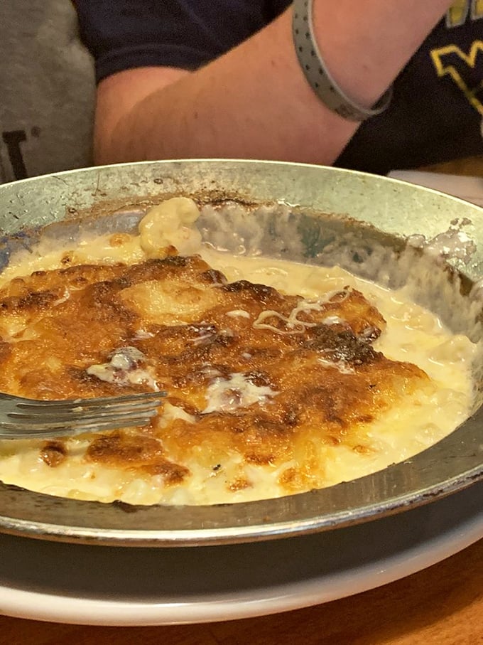 This isn't your boxed mac and cheese – it's a bubbling cauldron of comfort that your grandmother would approve of, if she were feeling particularly indulgent.