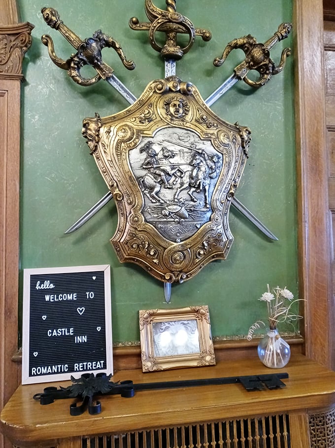 Medieval weaponry arranged with artistic flair—this decorative shield and sword display proves knights had a flair for interior design.