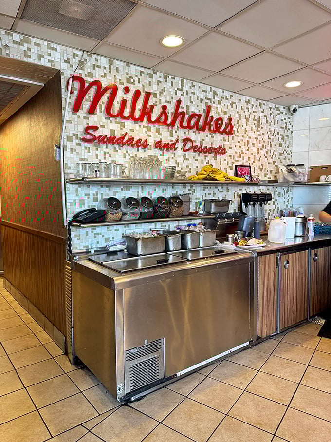 The milkshake station—where dairy dreams come true. That retro sign isn't just decoration; it's a promise of creamy happiness to come.