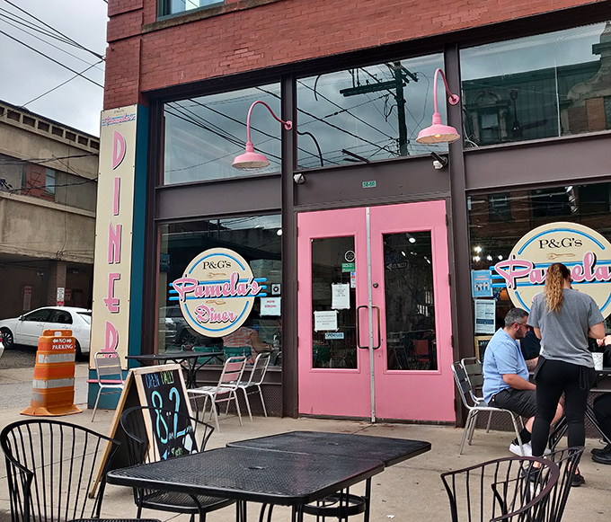 Those pink doors aren't just an entrance to a restaurant – they're a portal to a world where breakfast reigns supreme and pancakes change lives.