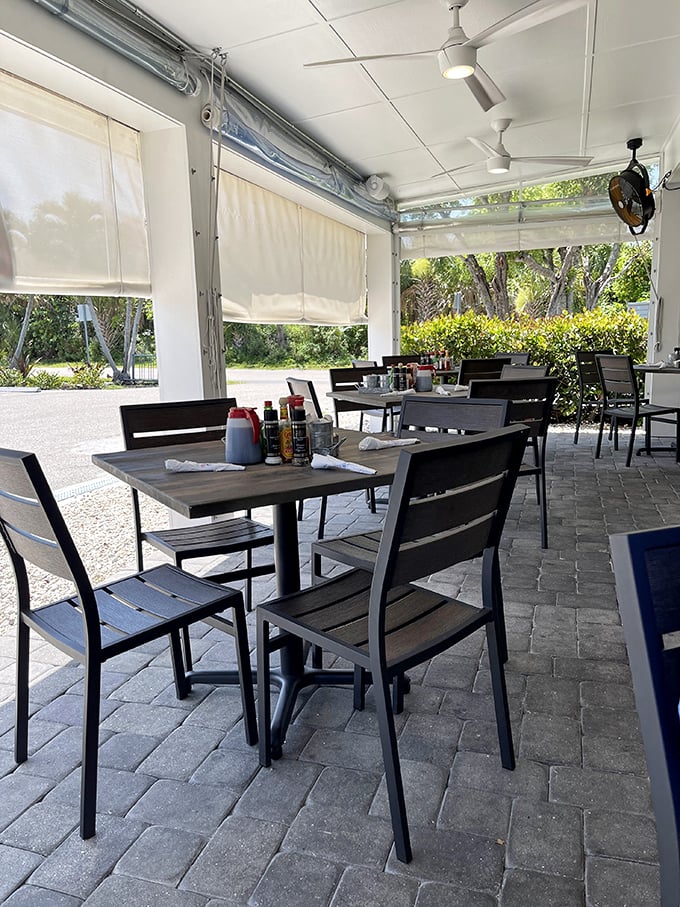 Island breezes and breakfast aromas mingle in the outdoor seating area—a perfect Florida morning in restaurant form.