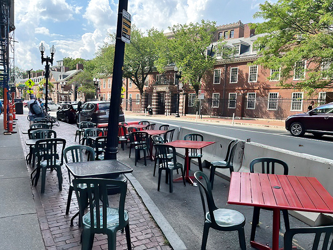 Harvard Square's historic backdrop provides the perfect setting for Bartley's outdoor seating. Academic prestige meets burger brilliance in this quintessential Cambridge scene.