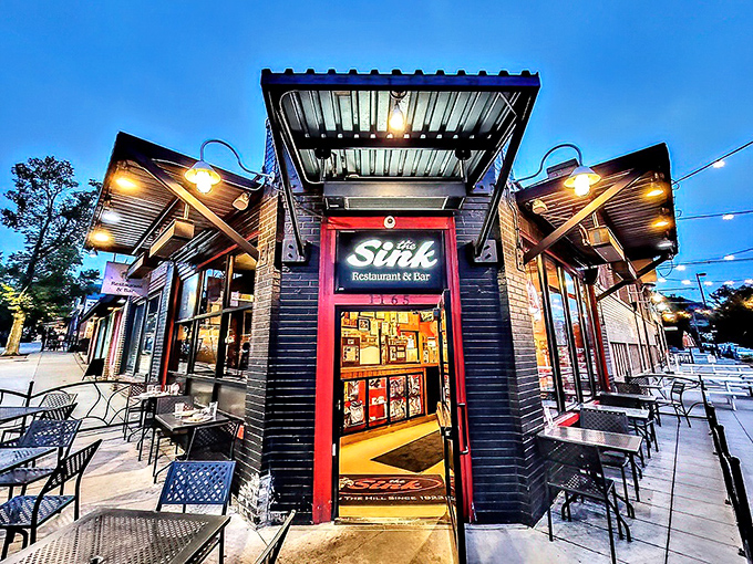 As dusk falls, The Sink's exterior lights up like a beacon for the burger-obsessed. Those string lights aren't decoration—they're a homing signal.