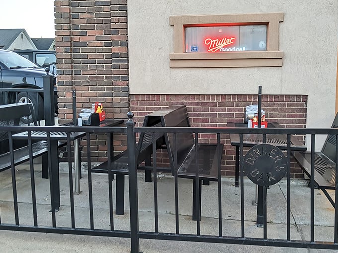 The outdoor patio—where fresh air enhances burger enjoyment. Even Miller High Life tastes better in this unpretentious setting.