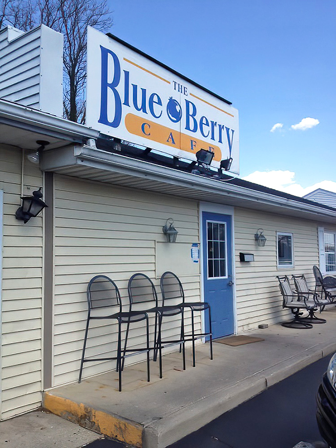 The blue door and simple exterior sign announce you've arrived at breakfast nirvana—those outdoor chairs ready for patient pilgrims awaiting their turn.
