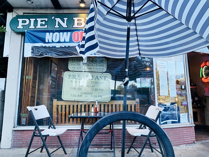 Even the outdoor seating maintains that mid-century charm—blue-striped umbrellas offering shade while you contemplate a second slice of pie.