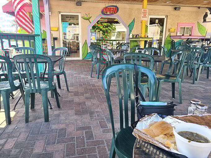 The outdoor patio—where sandwiches taste even better under Florida's blue skies, and vacation mode kicks in whether you're a tourist or local.