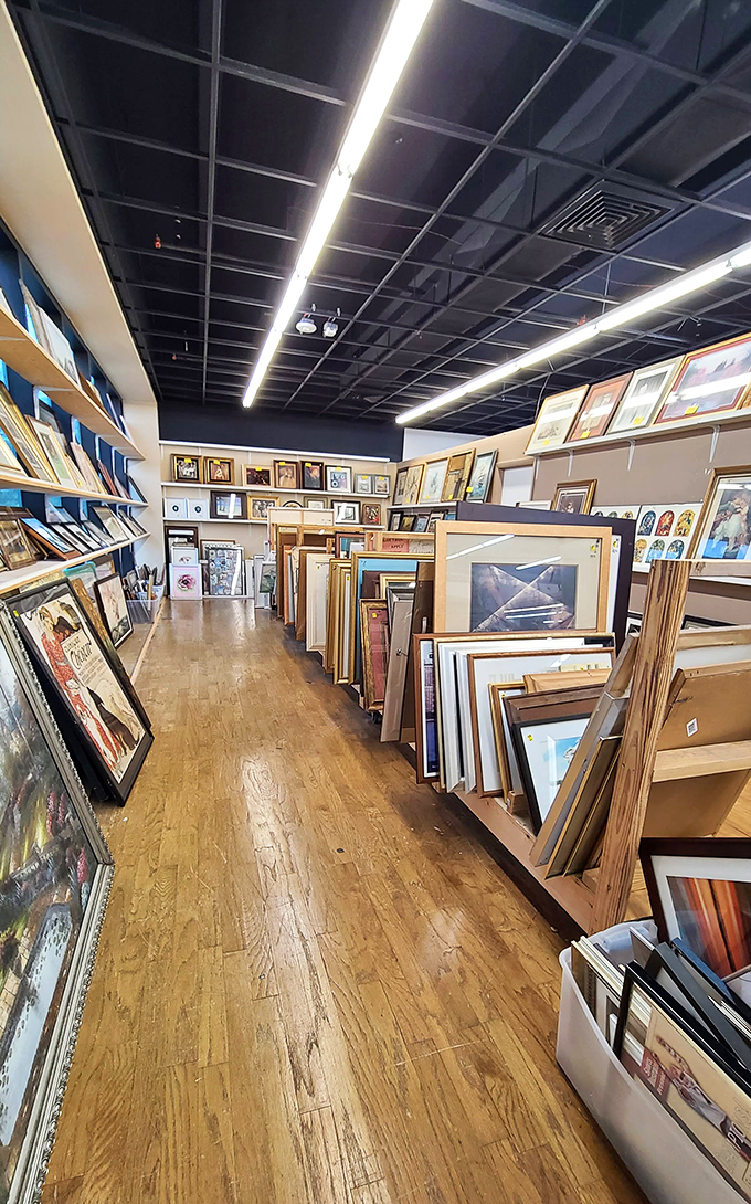 An art collector's playground where frames stack like dominoes, each hiding potential masterpieces or at least something perfect for above your couch.