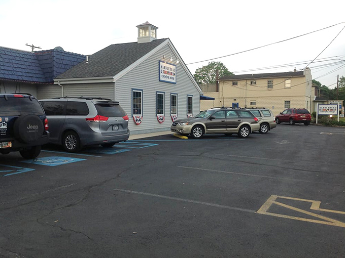 Even the parking lot maintains the coastal theme—where Pennsylvania license plates gather like seagulls around this slice of New England.