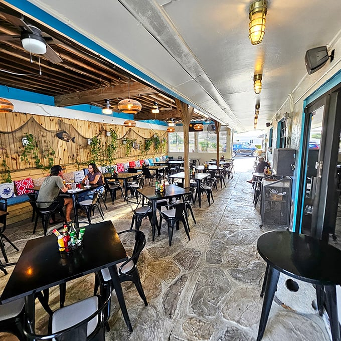 The patio offers that indoor-outdoor Florida living we all crave—casual seating, natural light, and the promise of a gentle breeze between courses.