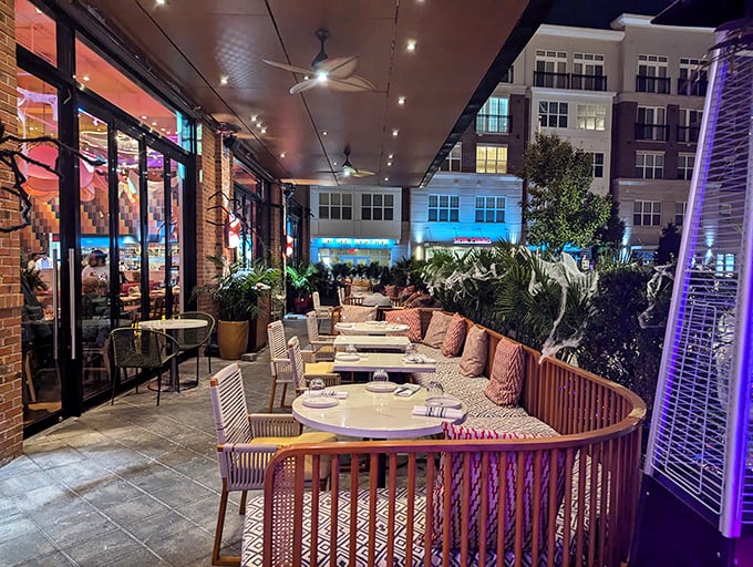 Outdoor seating that transitions seamlessly from day to night. Those purple lights aren't just for ambiance—they're for making your Instagram followers jealous.