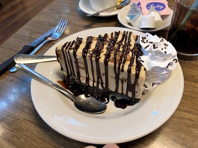 This isn't just pie—it's a slice of peanut butter paradise drizzled with chocolate that makes dieting seem like a terrible life choice.