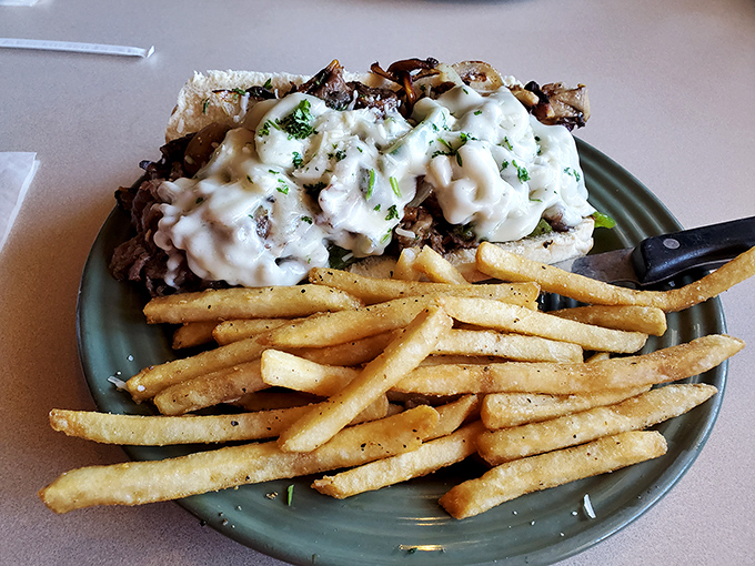This isn't just a sandwich – it's a mountain of meat and cheese that requires both commitment and napkins in equal measure.
