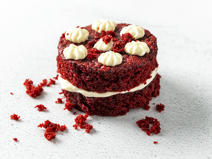 Red velvet cake so vibrant and moist it doesn't just satisfy your sweet tooth—it throws a tiny celebration on your taste buds.