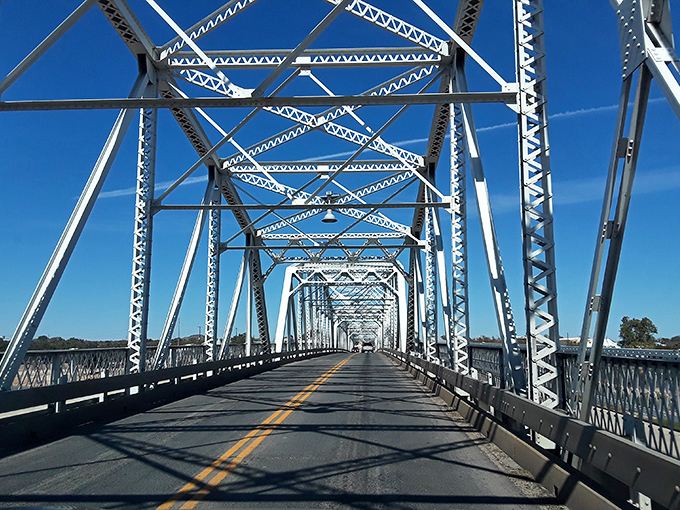 Crossing the Roy Inks Bridge feels like traversing between eras—its steel framework a testament to engineering that valued both function and beauty.