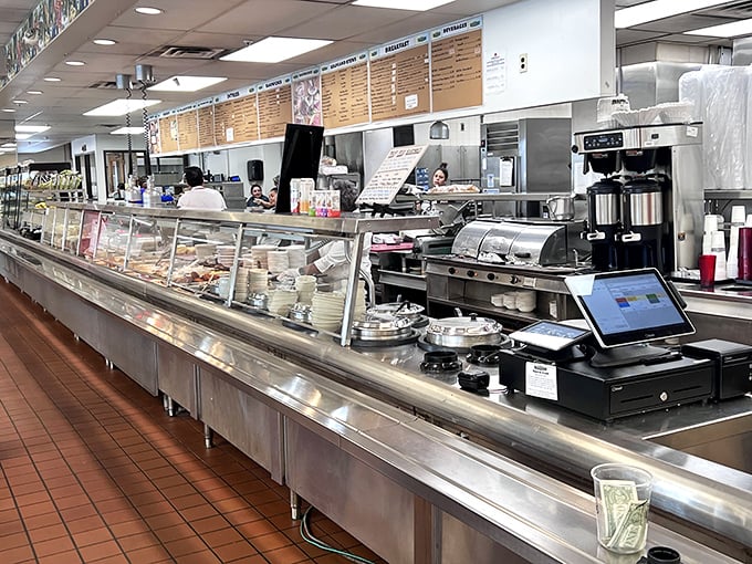The service counter where sandwich dreams become reality. Notice the tip jar—karma and good sandwiches both require proper funding.