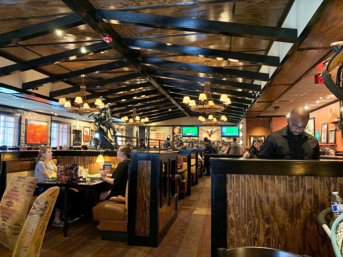 The dining room buzzes with energy as servers navigate between tables, orchestrating the delicate ballet of steak delivery with practiced precision.