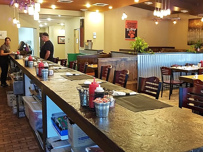 The counter where magic happens. Note the tiny metal condiment baskets—the unsung heroes of diner dining experiences everywhere.