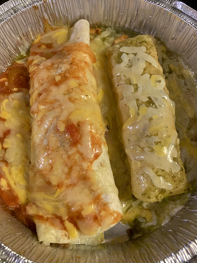 Red and green sauces create a Christmas-colored duet atop these enchiladas—proof that some gifts come wrapped in tortillas.