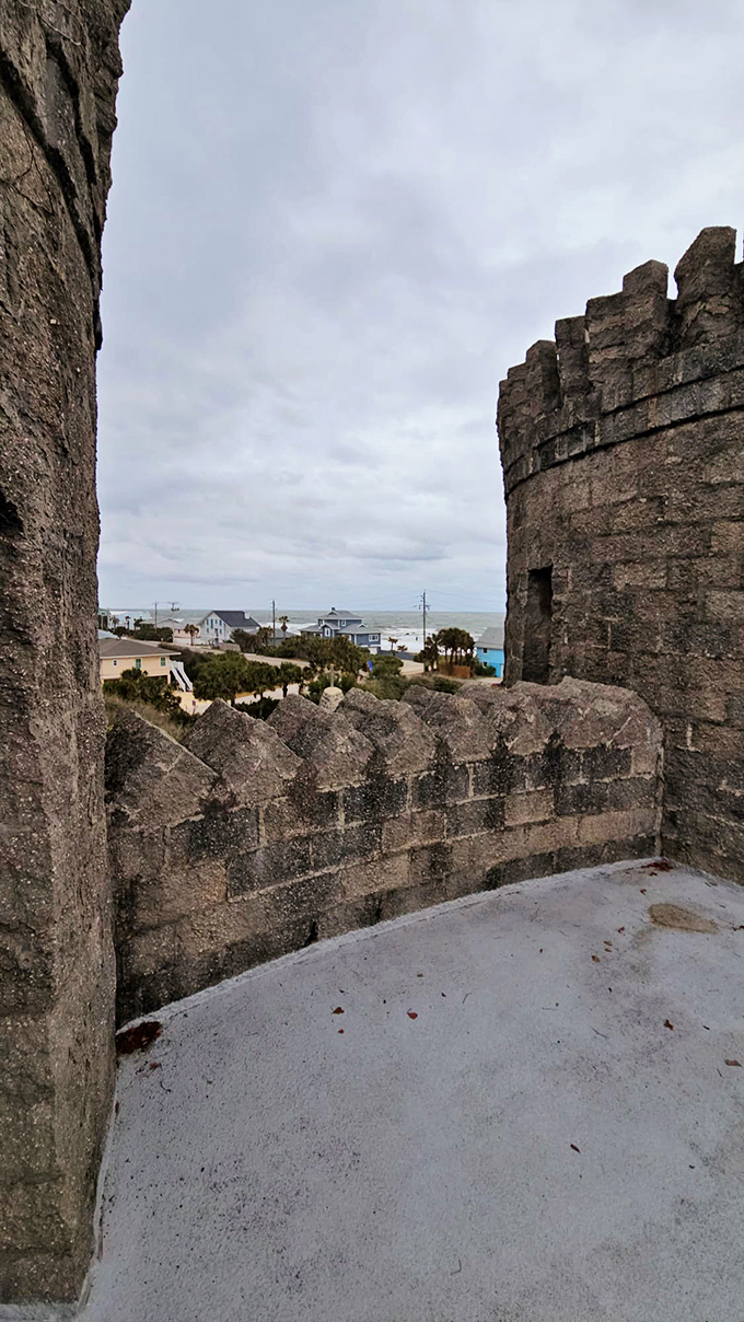 Between the castle's protective walls, visitors glimpse the Florida coastline—a surreal juxtaposition of medieval fortress and beach community.