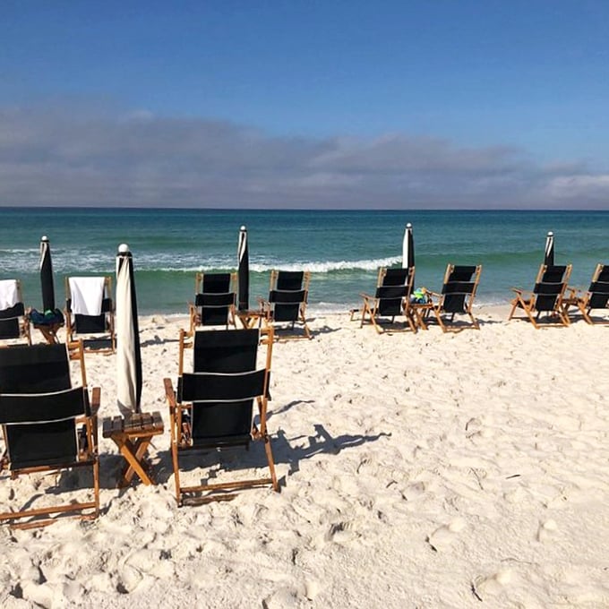 Beach chairs awaiting their next occupants—like a lineup of front-row seats to nature's best show: the Gulf of Mexico.