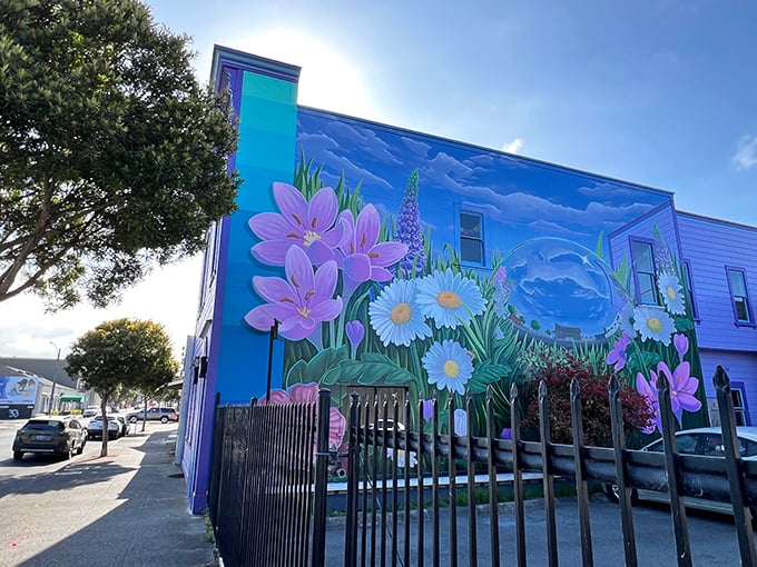 A building-sized bouquet blooms on this vibrant mural, proving that in Eureka, even the sides of buildings become canvases for botanical dreams.