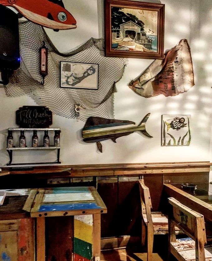 The wall decor tells seafood stories without saying a word—fishing nets and maritime treasures setting the perfect coastal mood.