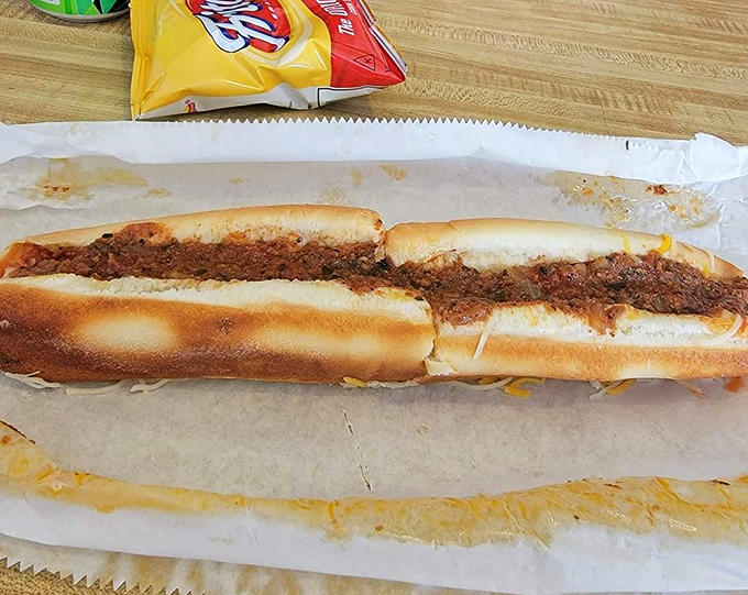 This foot-long masterpiece doesn't need fancy toppings to impress – just like how the best conversations don't need big words.