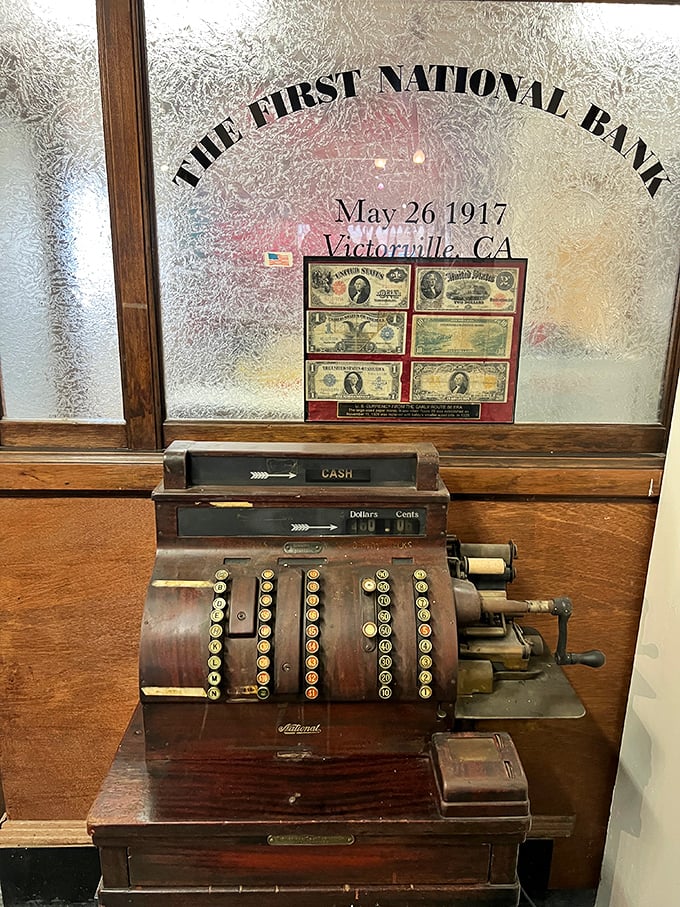 This vintage cash register once tallied the dreams of early Victorville entrepreneurs. The First National Bank display showcases commerce from simpler times.
