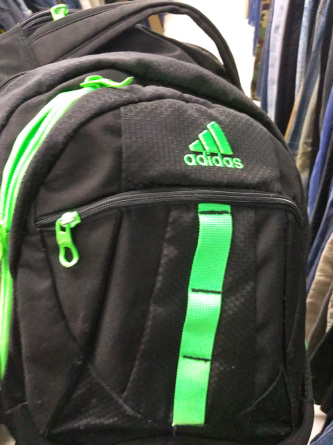 An Adidas backpack with electric green accents ready for its second act—school, gym, or weekend adventures await its new owner.