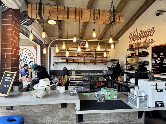 Edison bulbs dangle from repurposed beams while the counter awaits your order. The anticipation in this space is practically a physical force.