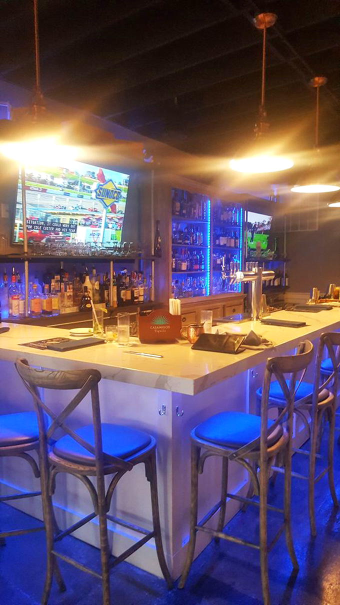 The bar glows with possibility, where craft cocktails are born and sports fans never miss a play—the perfect prelude to steak paradise.