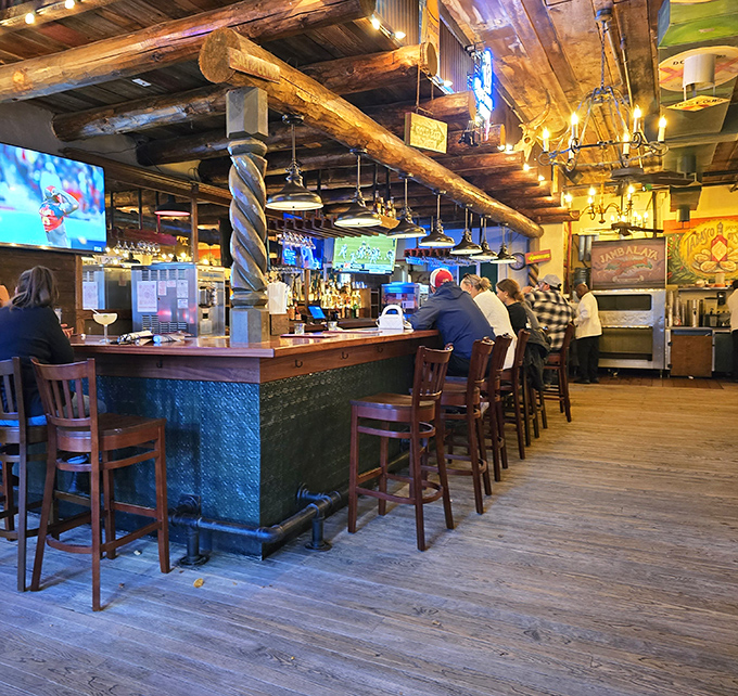 A bar that understands the serious business of fun. That twisted wooden beam has supported more elbows than a orthopedic surgeon.