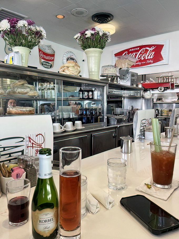 The counter area showcases both drinks and desserts, a dangerous proximity that has led to many "well, I'm already here" decisions.
