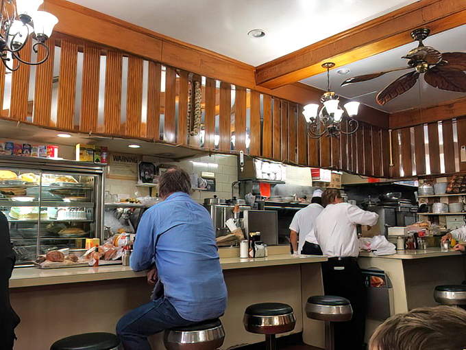 Where the magic happens: the open kitchen where cooks transform simple ingredients into dishes that have kept customers returning for decades.